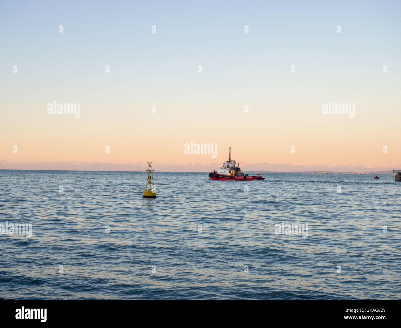 Port area. Tugboat on the road. A buoy in the bay of the port. Marine ...