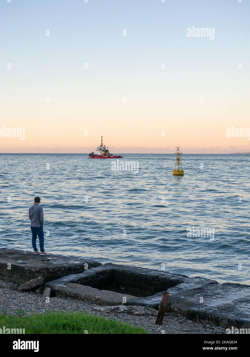 Port area. Tugboat on the road. A buoy in the bay of the port. Marine ...