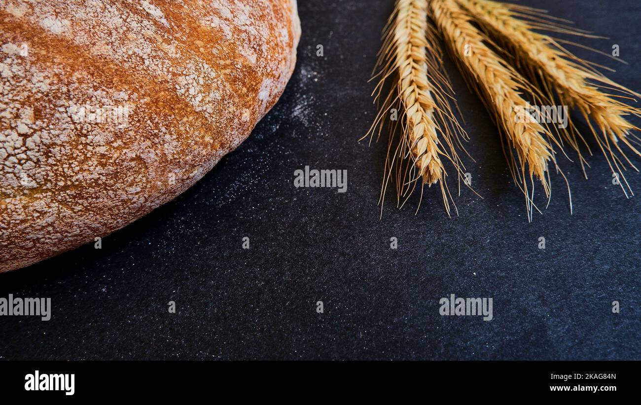 Ears of wheat and rustic bread, Ears and sourdough bread covering ...