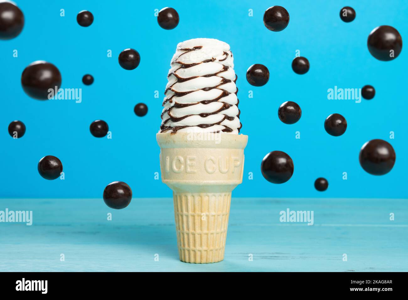 chocolate flavor ice cream cone with floating chocolate candies ...