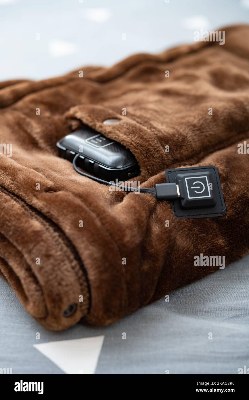 angle view rolled up electric blanket with portable charger as a power ...