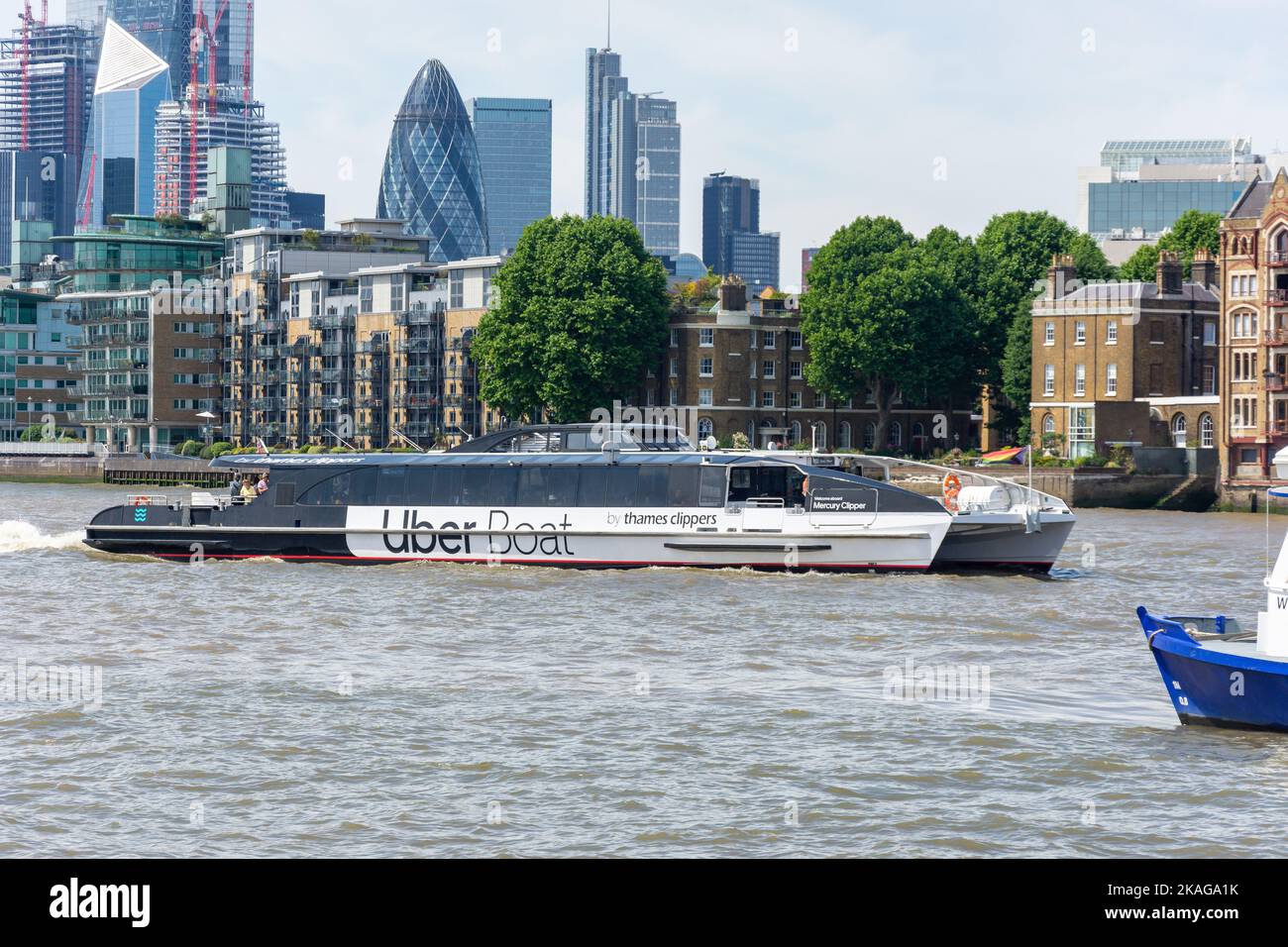 Uber Boat ferry from Thames Path wall, Rotherhithe, The London Borough ...