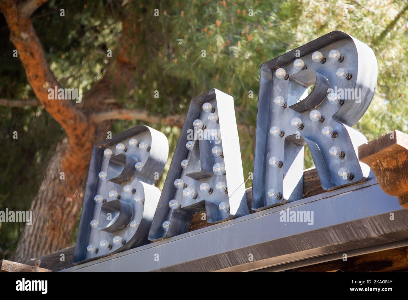 Industrial Marquee letters Bar Sign with Bulbs on Roof of Business ...