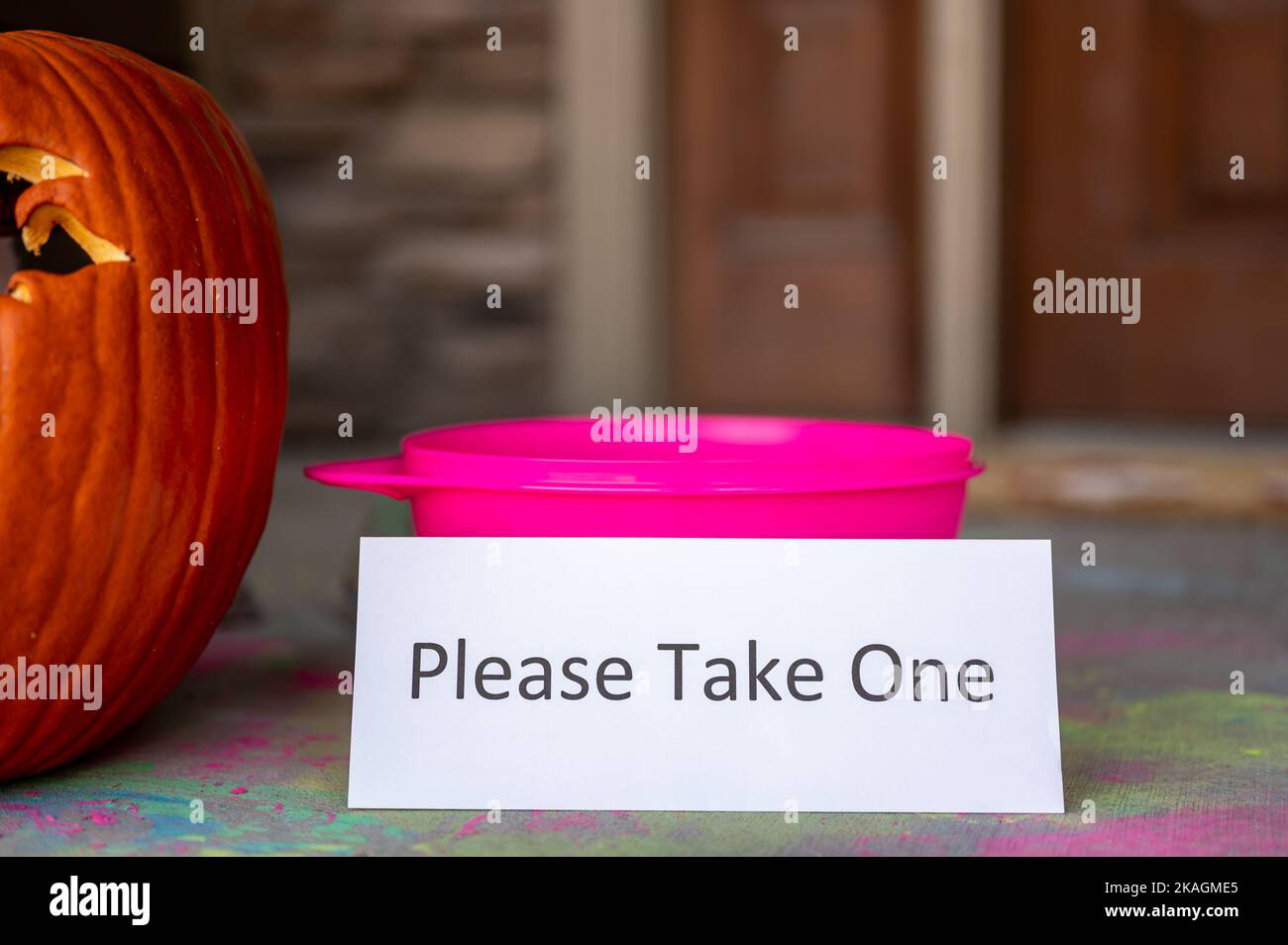 Bowl sitting on a doorway with a sign stating to please take one for ...