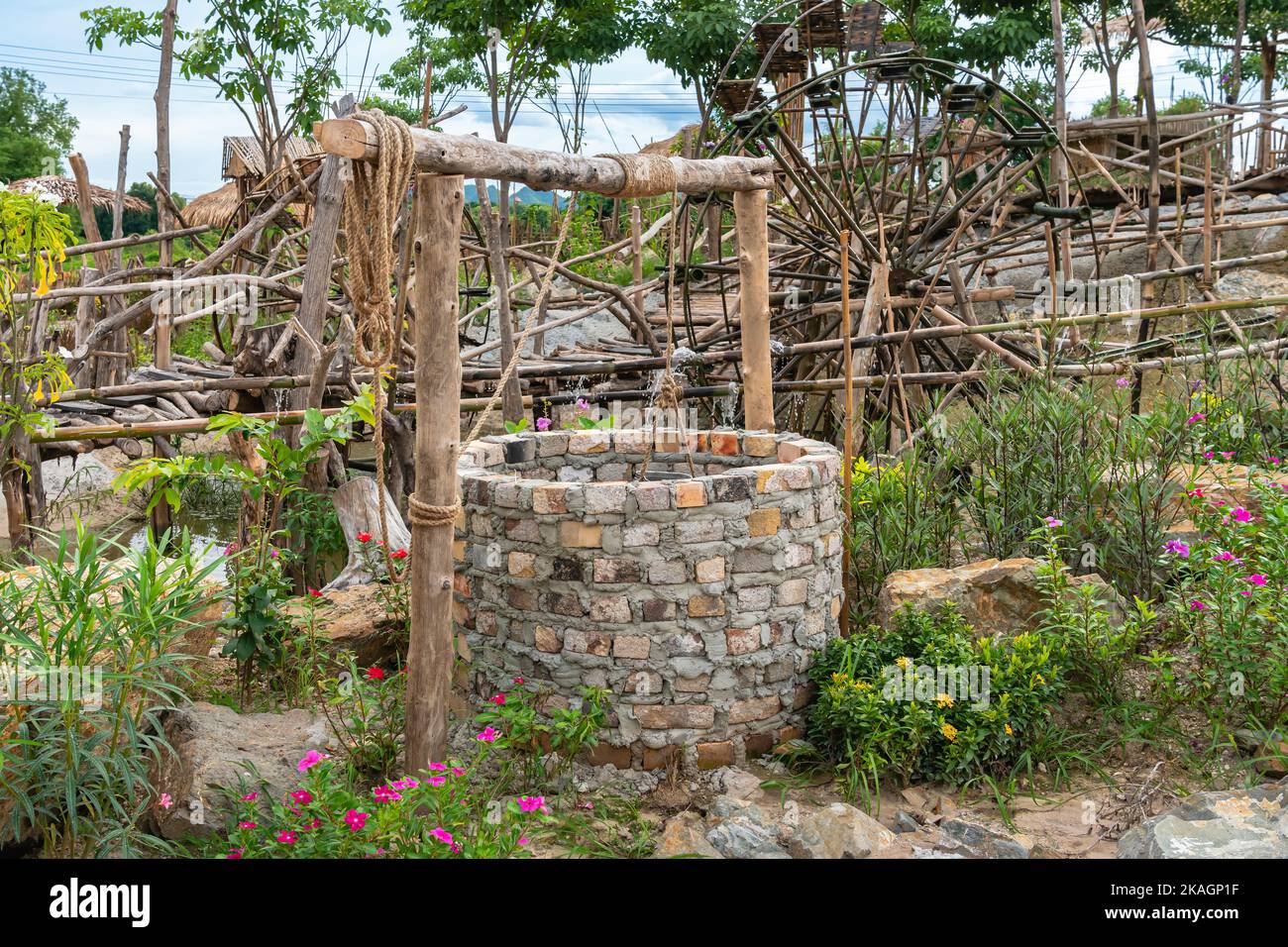 Beautiful artesian well made by bricks with cement and wheel pulley ...