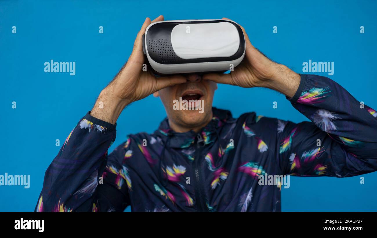 man with 3d glasses on a blue background Stock Photo - Alamy