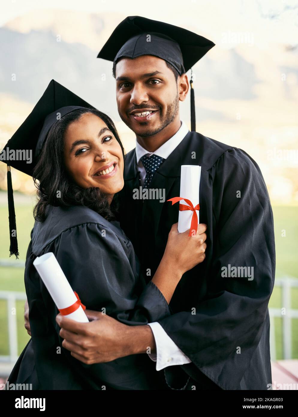 Weve sacrificed a lot for this achievement. Portrait of two students on ... Weve sacrificed a lot for this achievement. Portrait of two students on ...