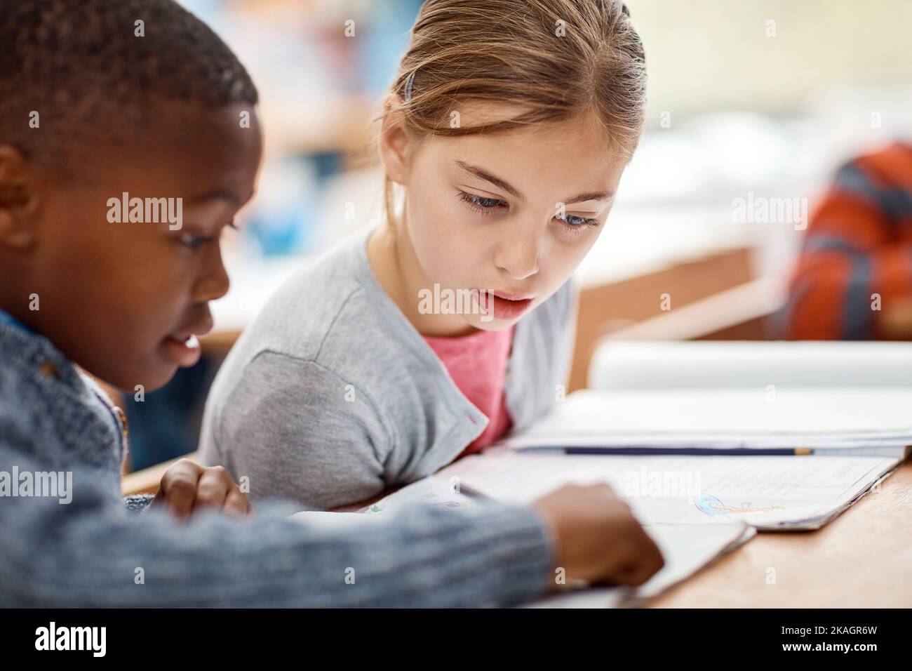 Theyre two focused learners. elementary school kids working together in ...