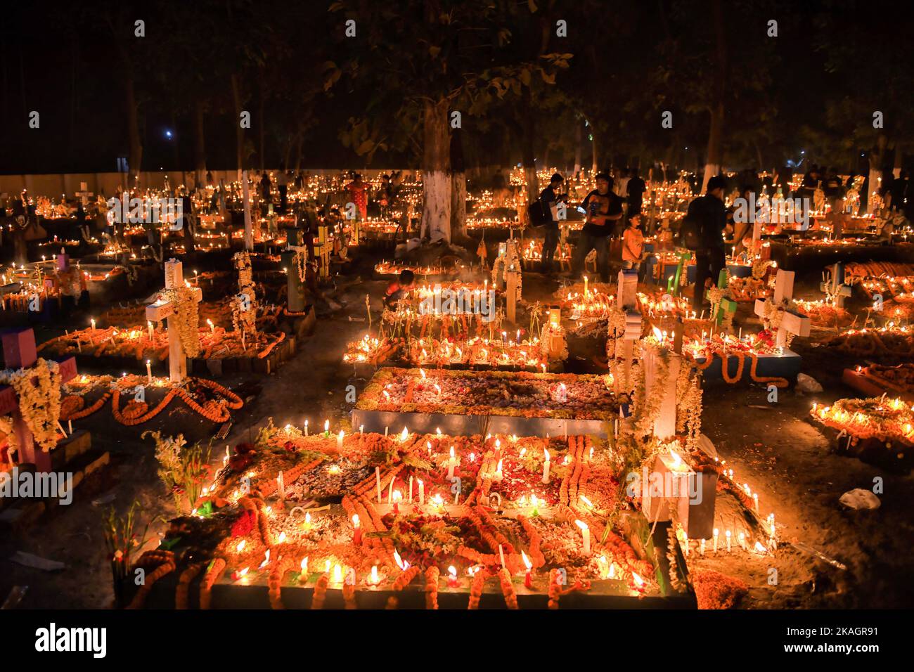 Nadia, India. 02nd Nov, 2022. Graves seen well decorated with flowers ...