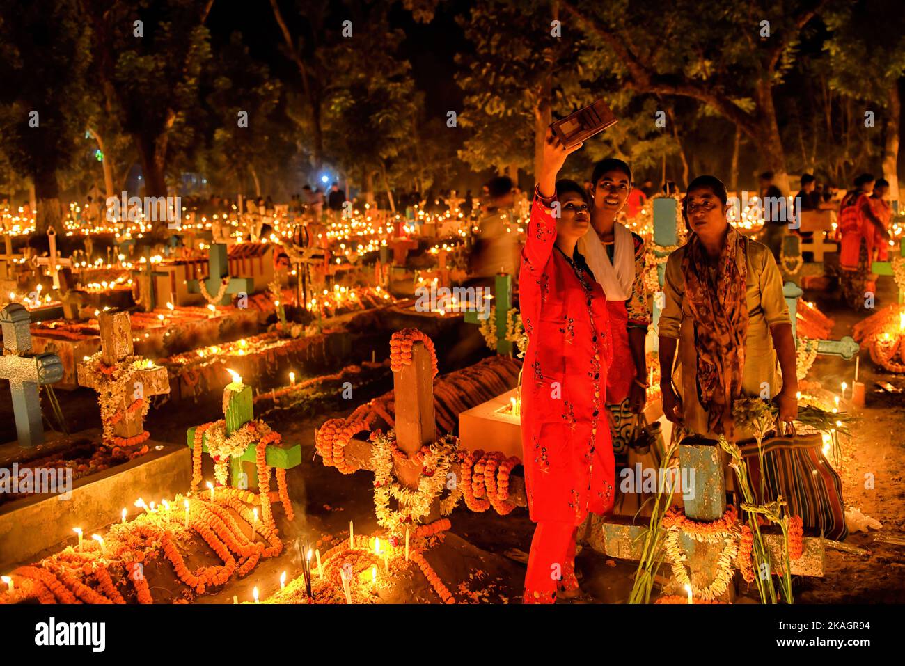 Nadia, India. 02nd Nov, 2022. People take selfies at a cemetery during ...