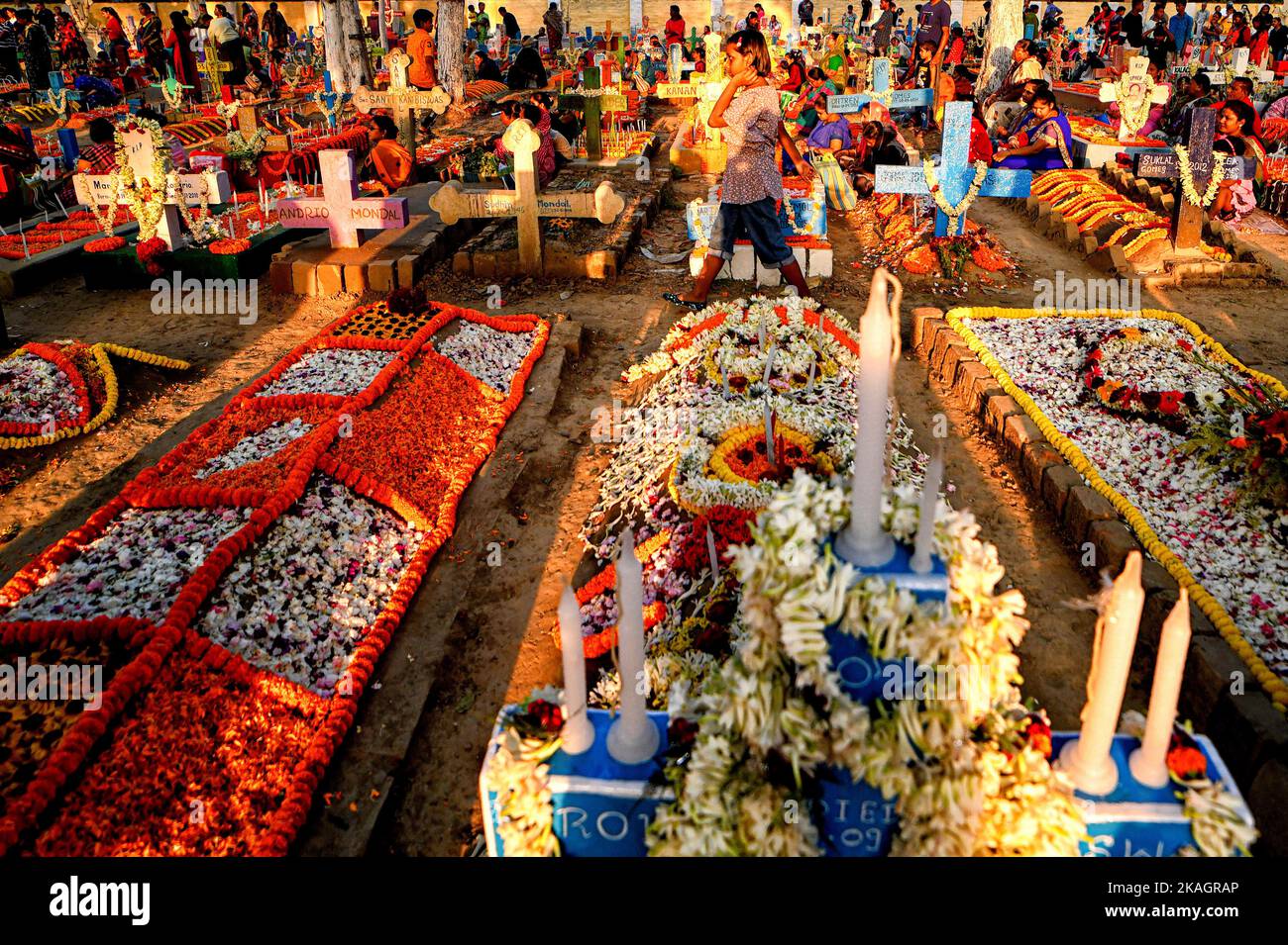 Nadia, India. 02nd Nov, 2022. Graves seen well decorated with flowers ...