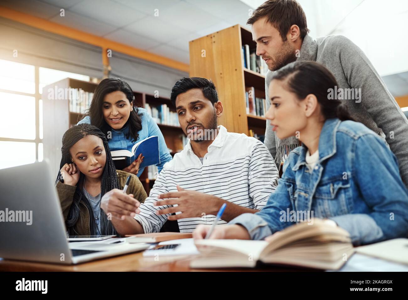 Woman helping man in library hi-res stock photography and images - Alamy