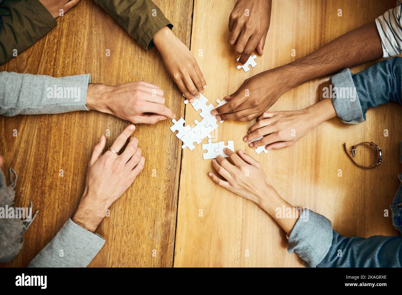 Teamwork gets the job done. High angle shot of a group of ...