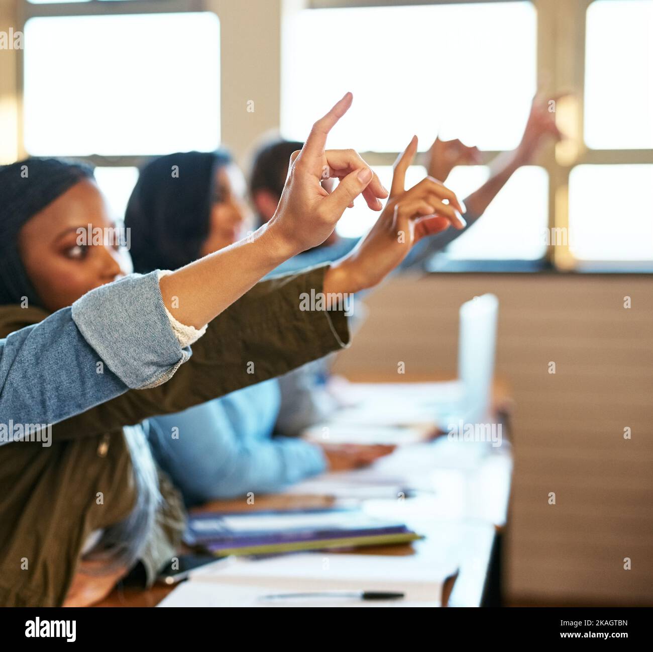 Happy classroom raised hands ethnic hi-res stock photography and images ...