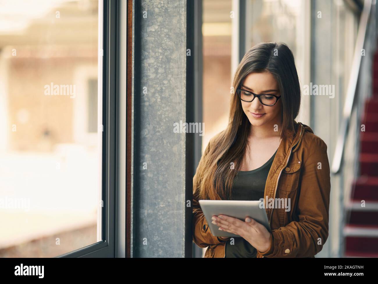 Shes got all the study notes on her tablet. an attractive young ...