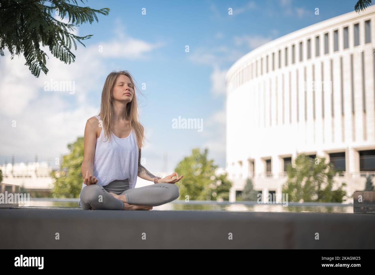 Girl practice yoga meditation outdoor in park Stock Photo - Alamy