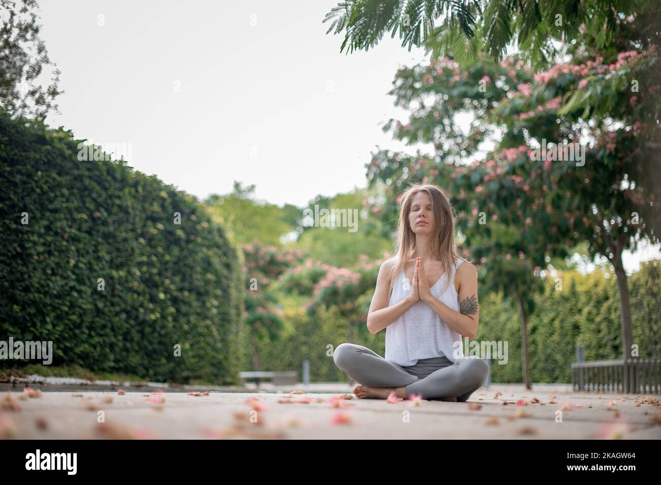 Girl practice yoga meditation outdoor in park Stock Photo - Alamy