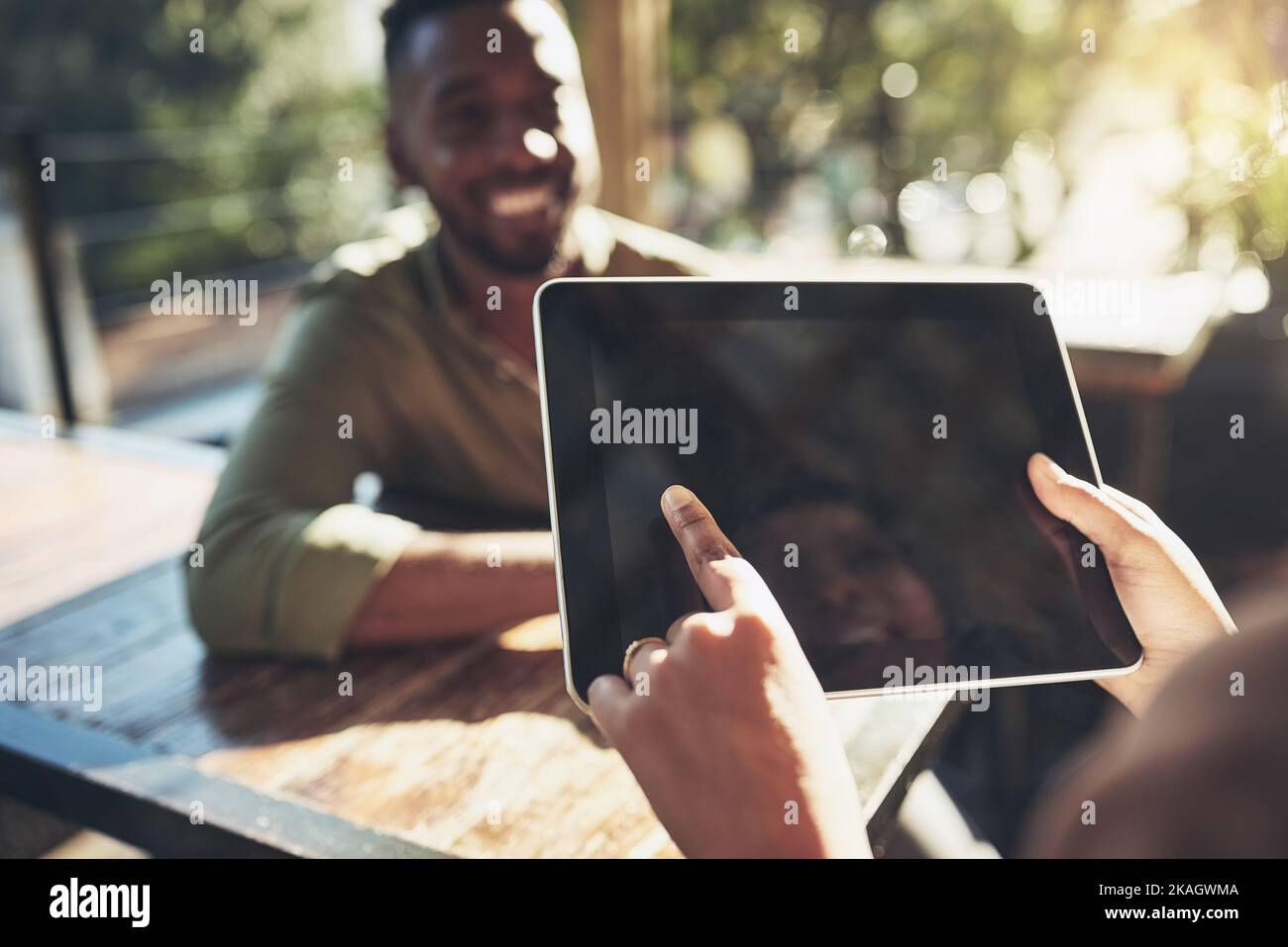 Are you getting the usual. a young man placing his order with a waiter ...