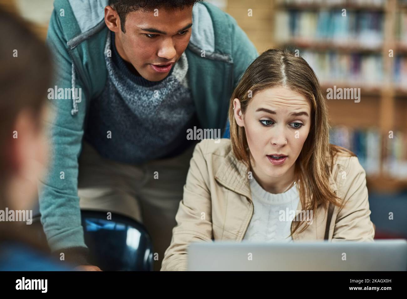 Helping each other with their assignments. university students working ...