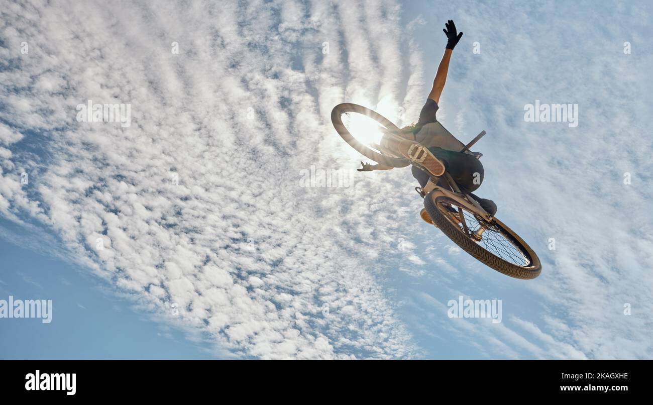 Cycling jump, blue sky or man on mountain bike does air trick for fun ...