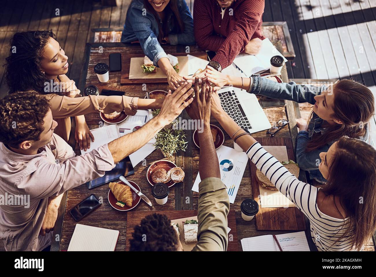Enjoying a lovely lunch with colleagues. High angle shot of a group of ...