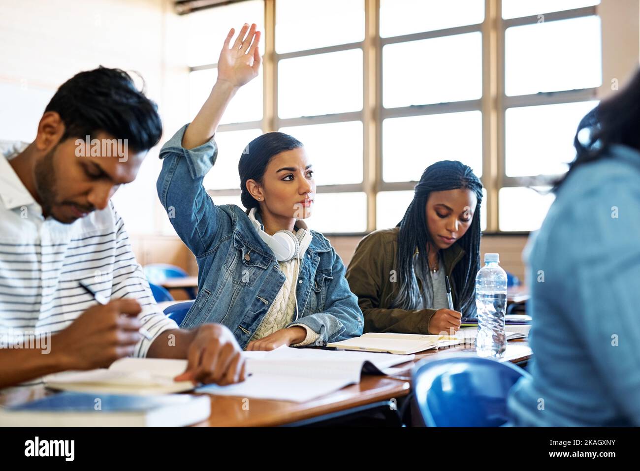 Shes got the answer. an attractive young university student sitting in ...