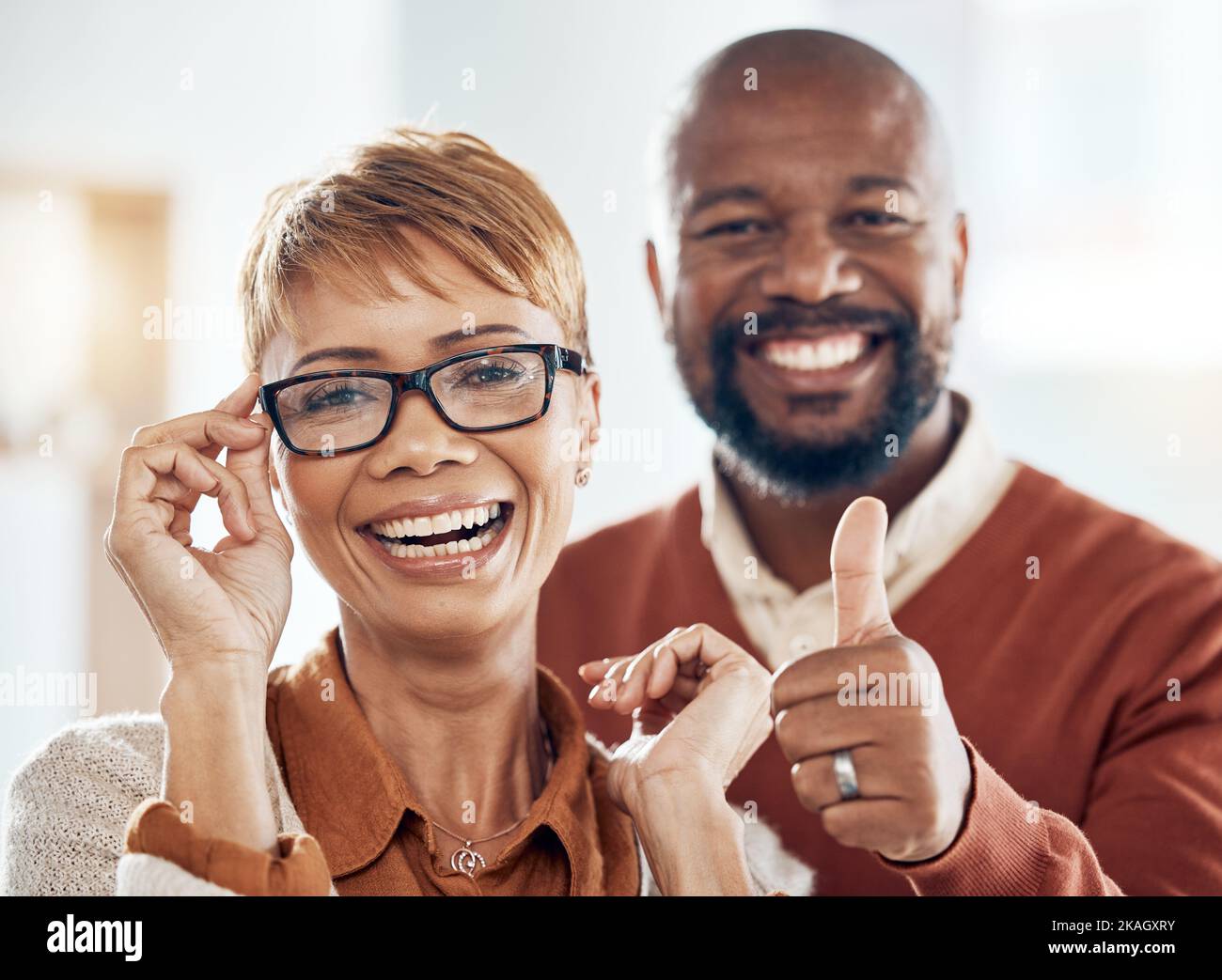 Black woman, man and thumbs up for vision, eyes healthcare or glasses ...