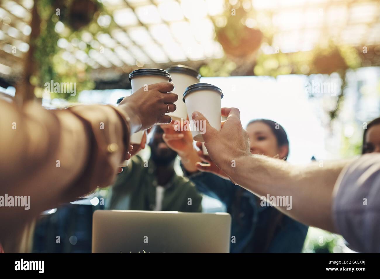 That deserves a toast. a group of creative employees toasting with ...