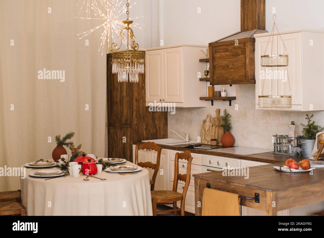 Christmas living room with a festive dining table with wooden chairs in ...