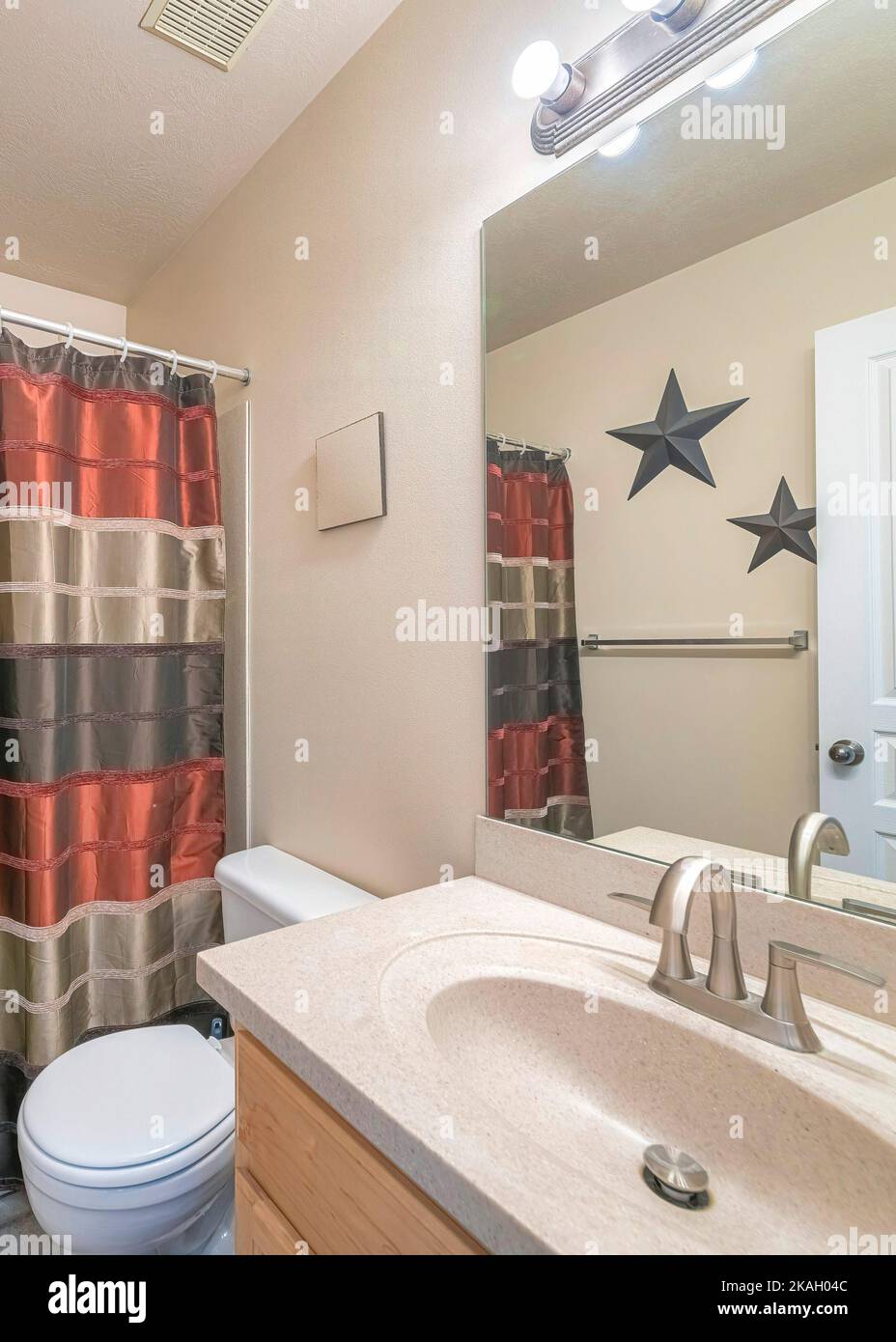 Vertical Traditional small bathroom interior with satin shower curtain ...