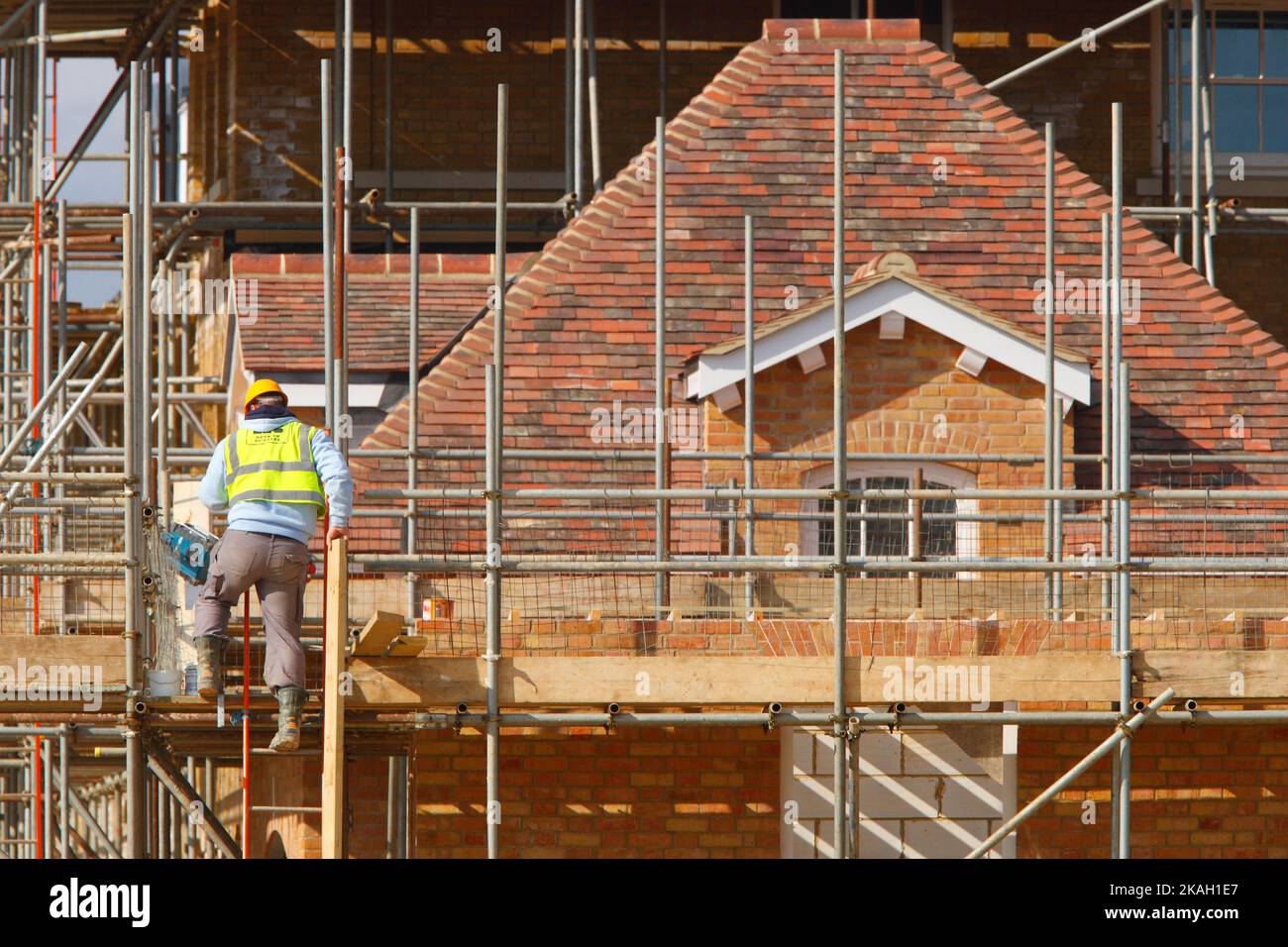 File photo dated 02/03/09 of a builders at work on a new build home, as ...