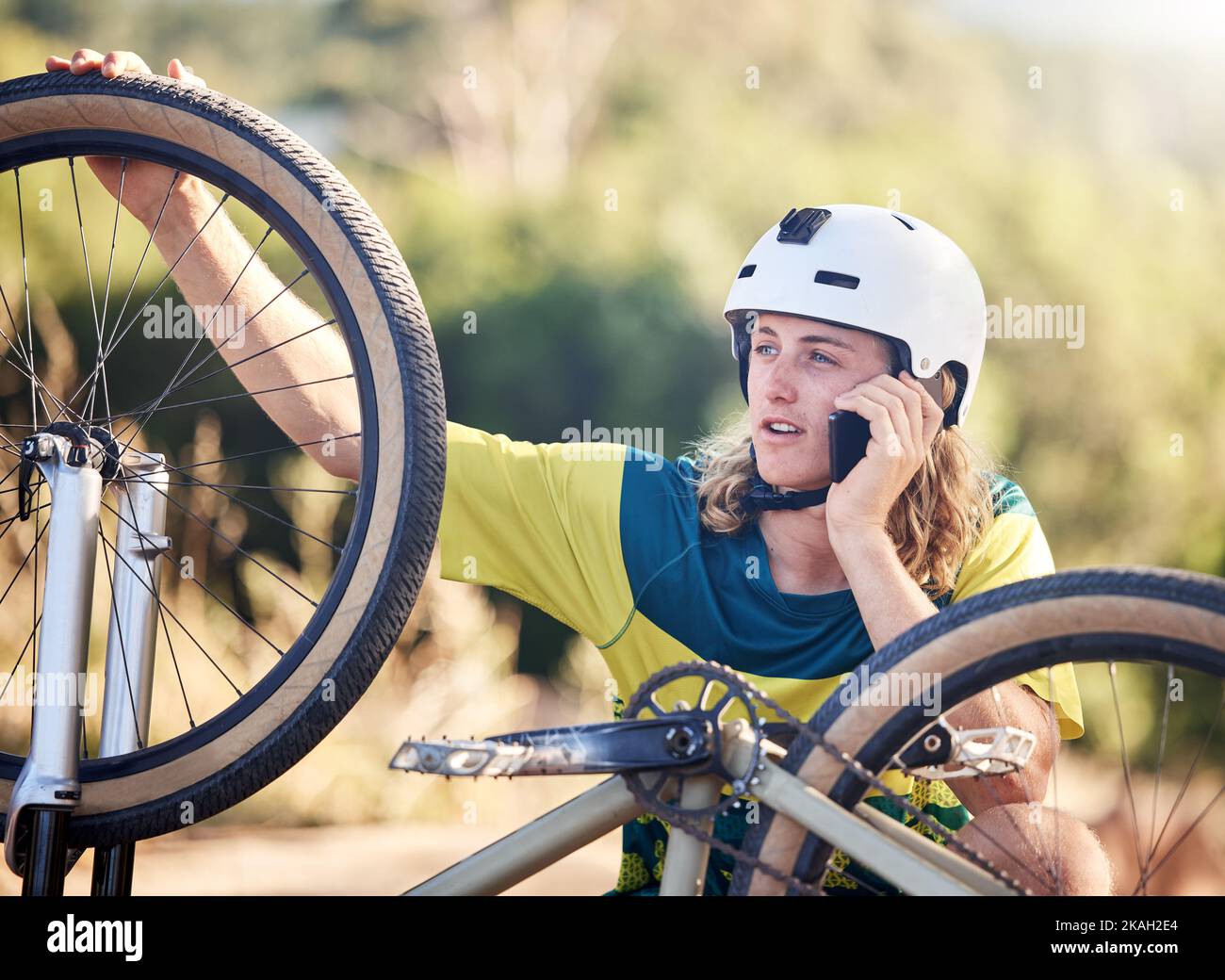 Phone call, bike and fitness with a man cyclist talking using 5g mobile technology while outdoor ...