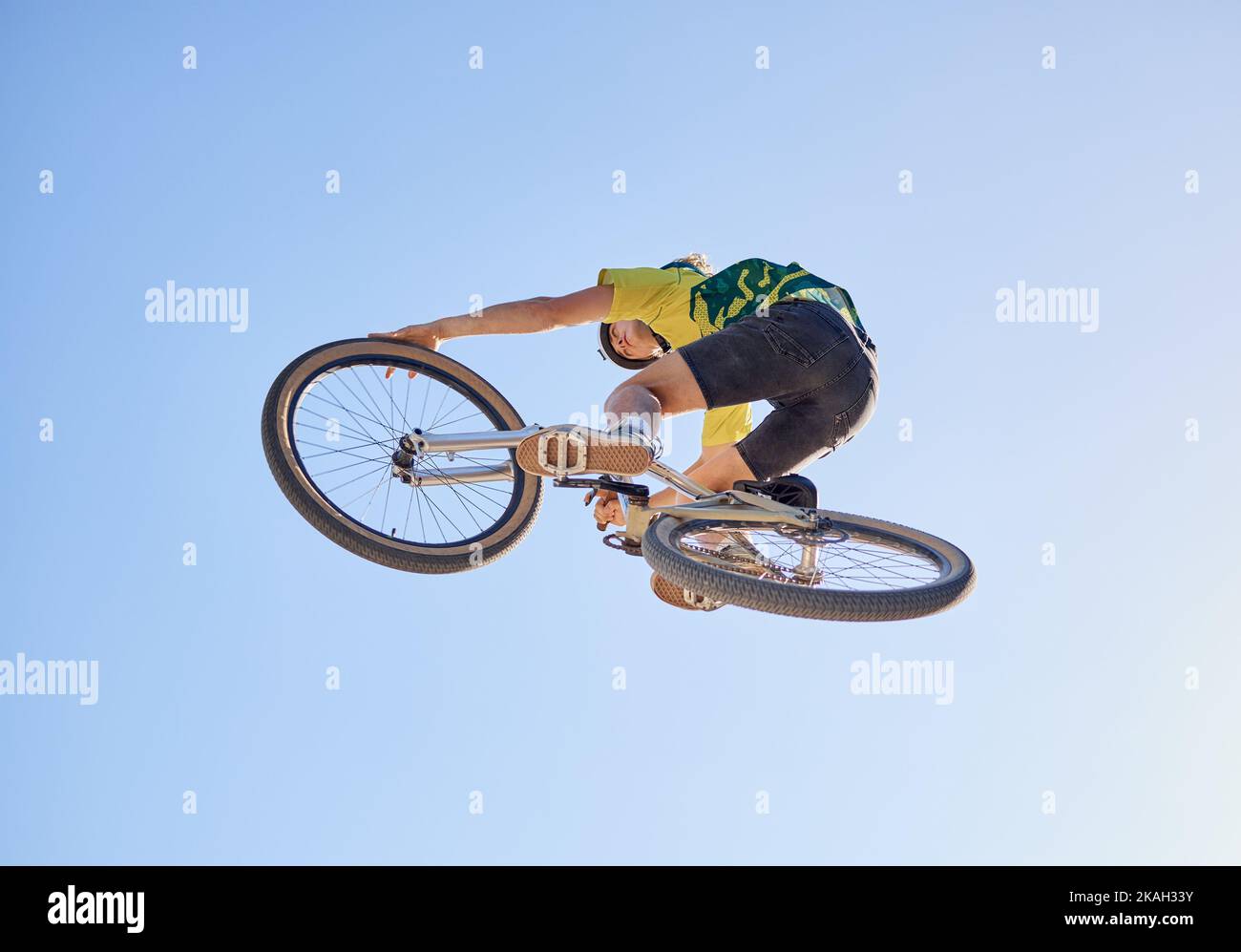 Bicycle, cyclist man and jump of adrenaline junkie from below riding in ...