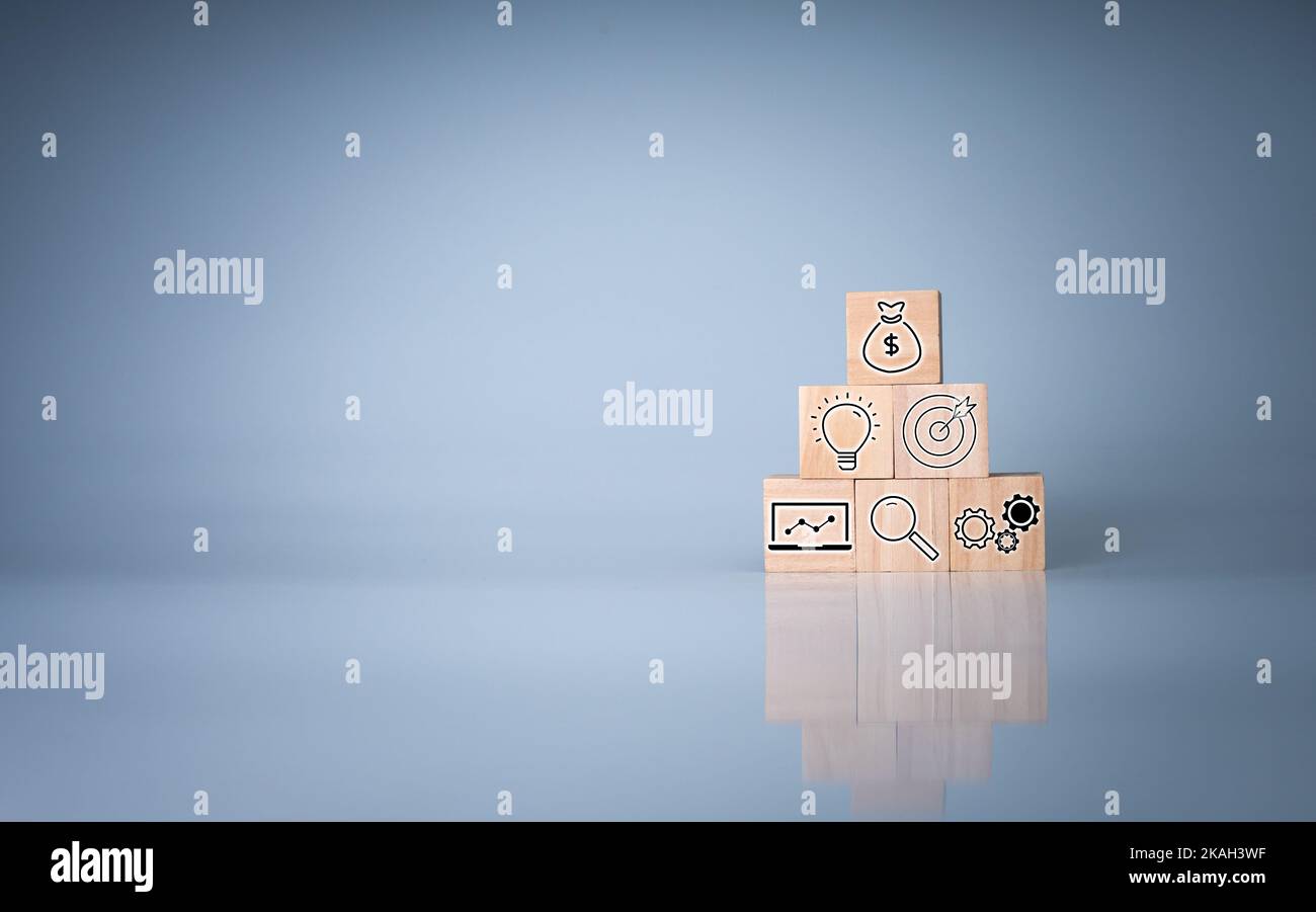 Wood cube block stacking with icon.Concept of business strategy and ...