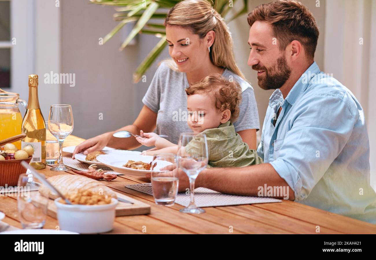 Family, food and lunch outdoor with child, mom and dad together for ...