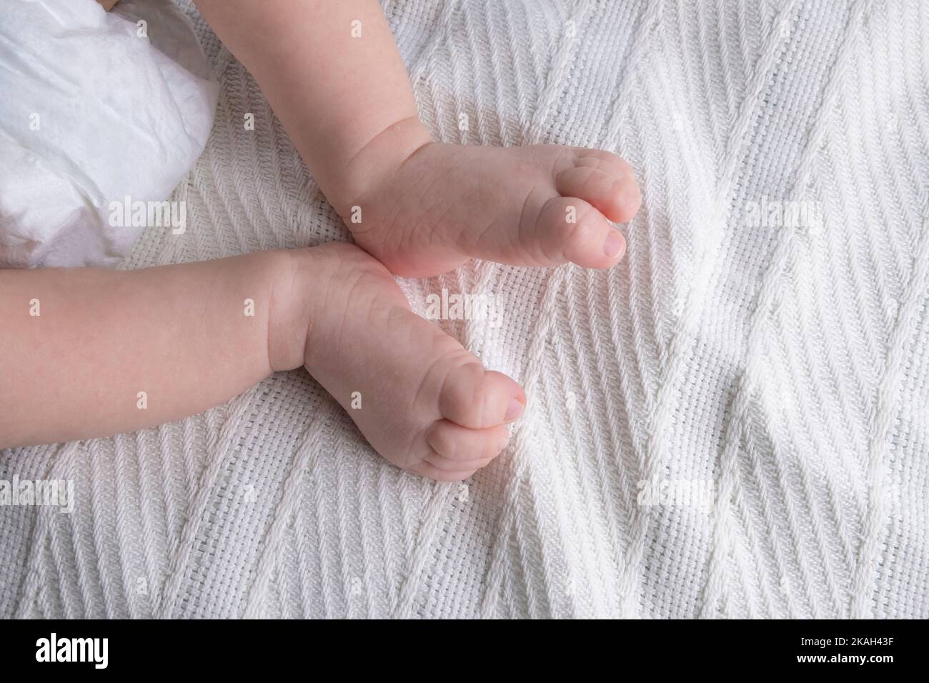 legs of a baby or a newborn child on a light background close-up Stock ...