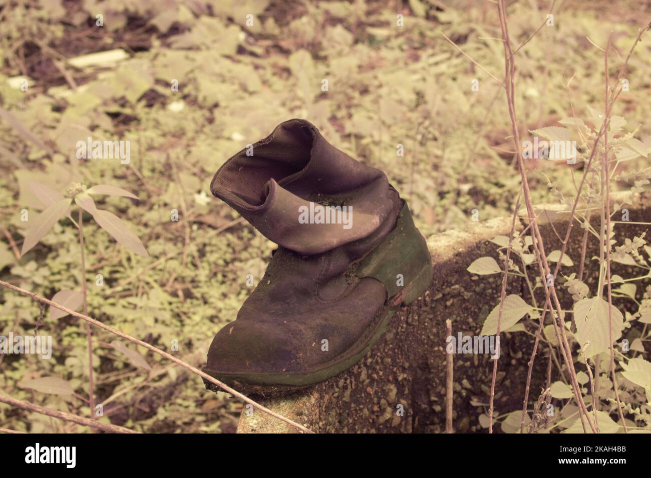infrared image of the unwanted and worn out single boot at the farm ...