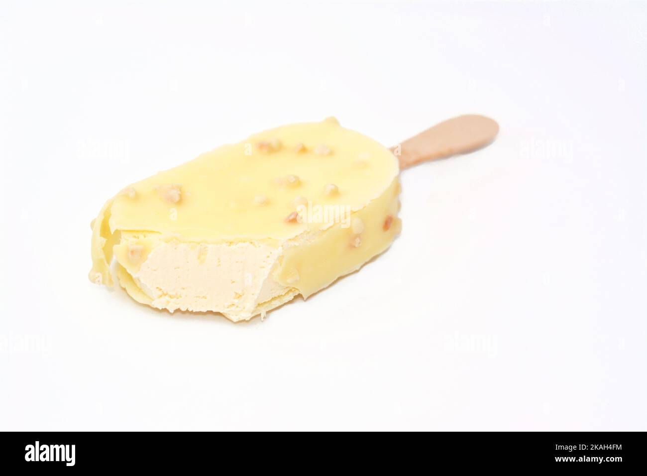 Vanilla ice cream stick coated and covered with a layer of white ...