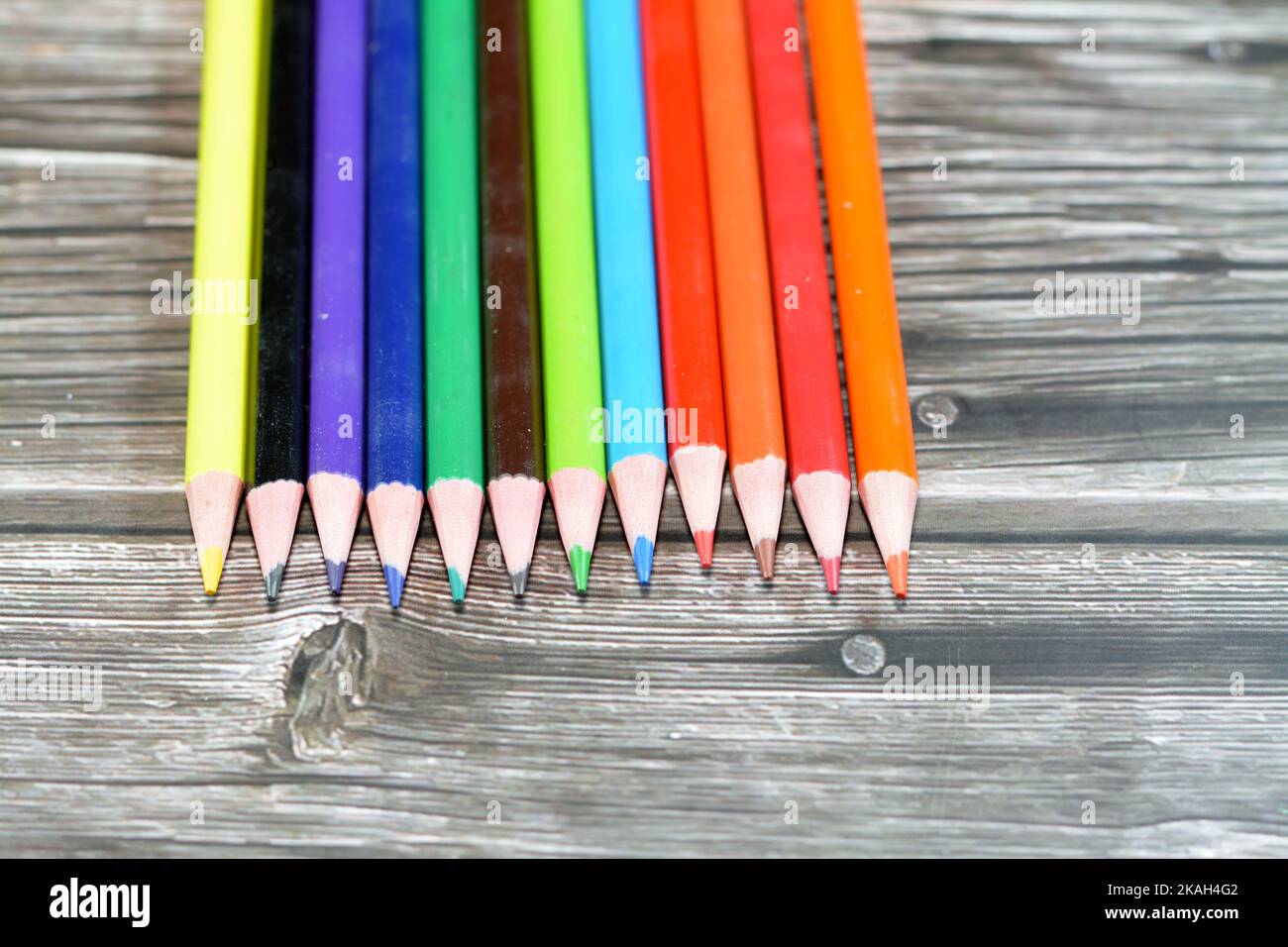 wood color pencils of different colors for painting isolated on wooden ...