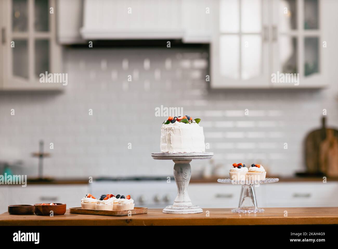Dessert cake on kitchen table. Cakes cupcakes and sweet dessert Stock ...