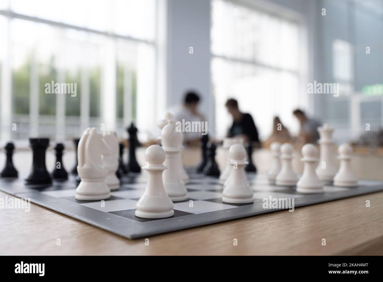 New chess board with chess pieces on table for game Stock Photo - Alamy