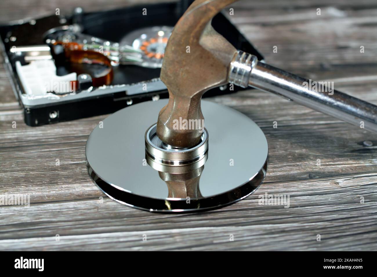 A steel hammer on HDD platters and spindle motor, hard disk drive ...