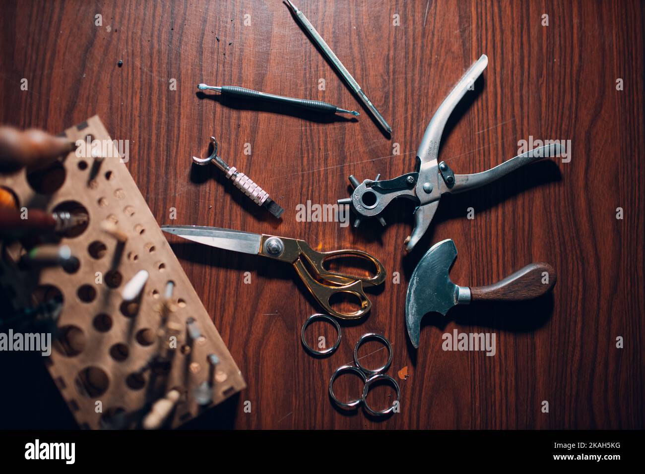 Tanner tools for leather goods on workshop. Working process of leather ...