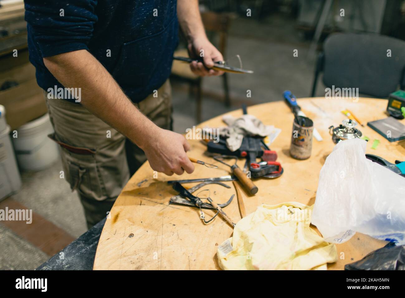 Man sculptor creates sculpt bust clay human woman sculpture. Statue ...