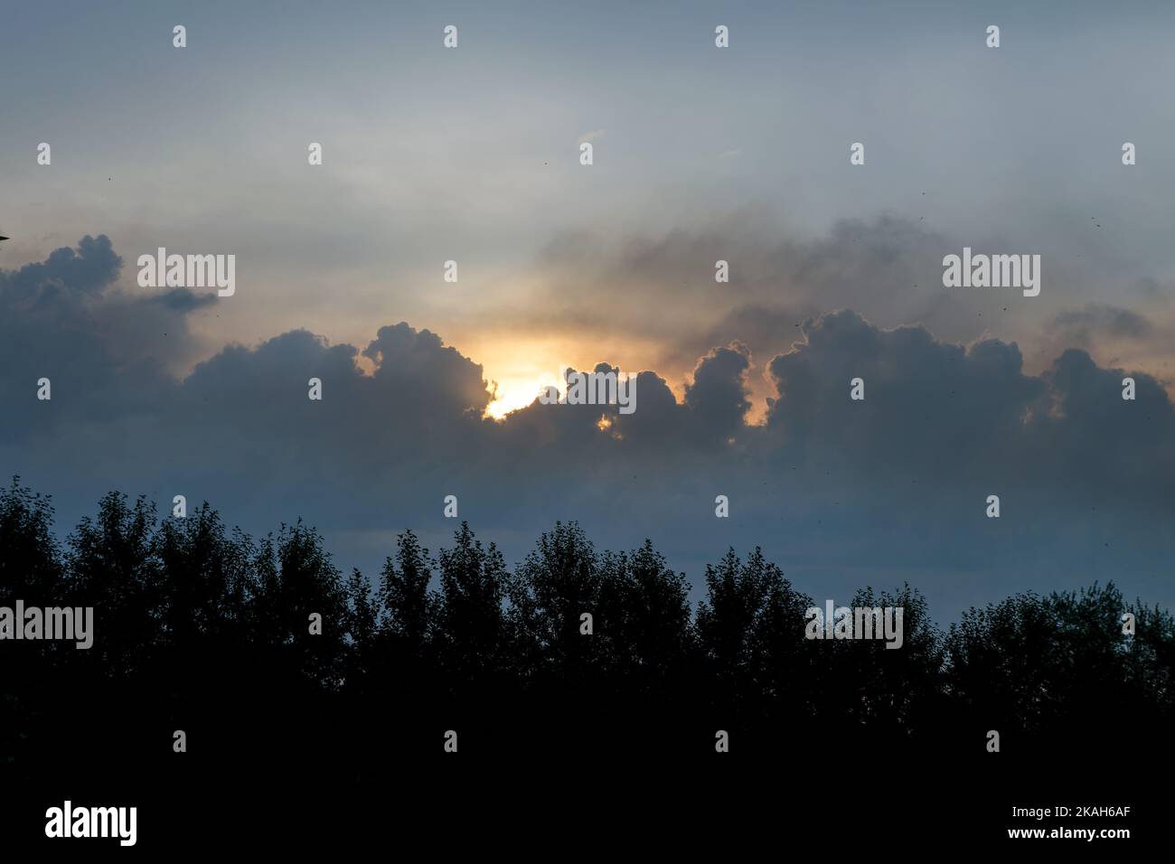 Evening sky in the picturesque clouds, lit by the rays of the setting ...