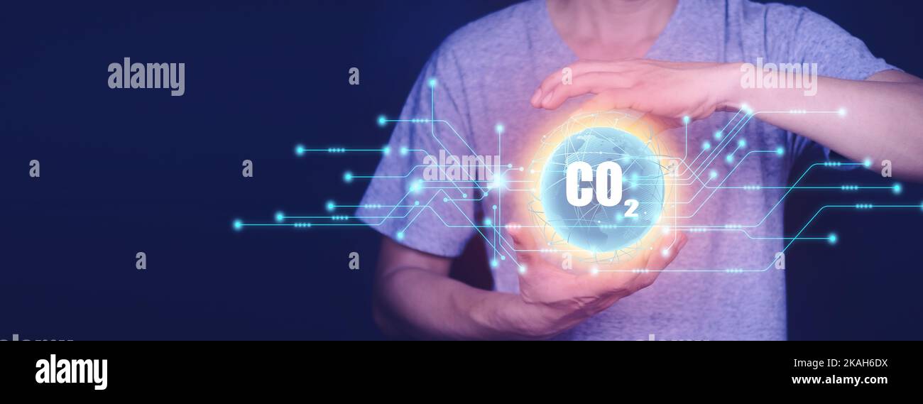 Reduce CO2 emission concept in the hand for environmental, global ...
