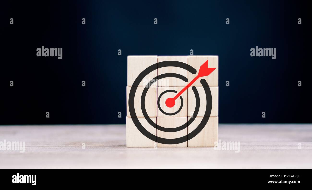 Objective and target concept. Arrow upward to target on wooden cubes ...