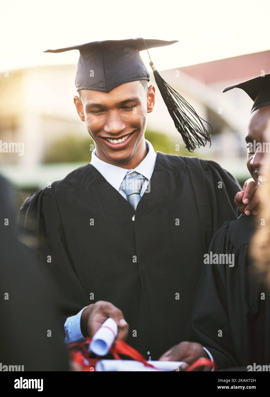 Education is the key to success. a group of students holding their ...