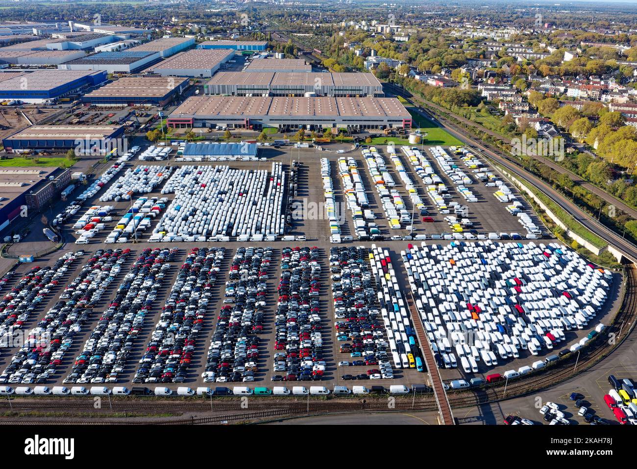 Car terminal in a port on the Rhine river. Vehicles are stored, loaded ...