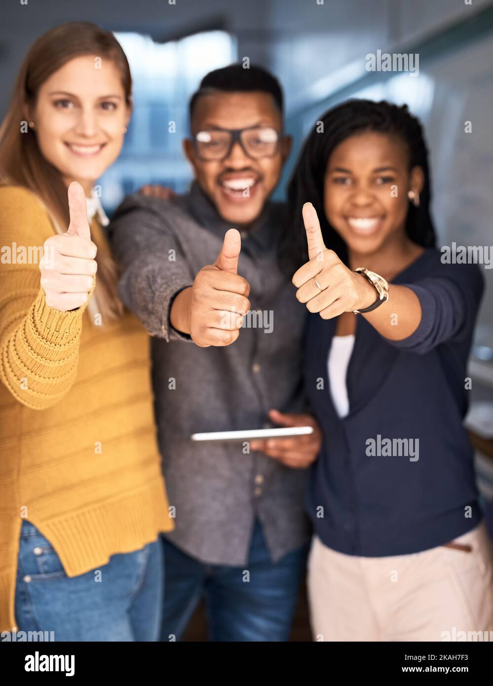 Thumbs up to this project being a success. university students showing ...